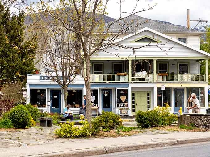 That classic white porch wrapping around says "come sit a spell" louder than any welcome mat ever could.