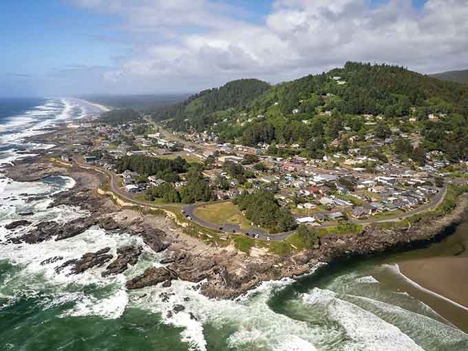 Rocky headlands frame a town where ocean spray meets river calm, creating nature's own dramatic theater.