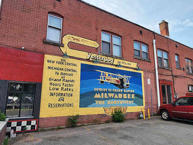 That vintage hand-painted mural tells you everything: this brick building has been serving hot dogs with serious Grand Rapids pride.