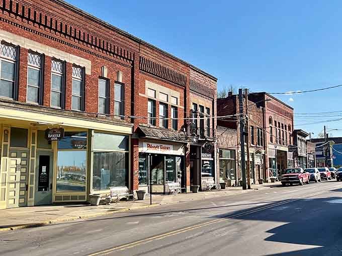 Sunlight bathes the storefronts in golden warmth, highlighting architectural details that modern construction just can't replicate anymore.