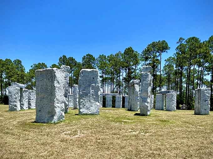 Bright sunshine illuminates these towering fiberglass pillars, creating shadows that dance across the manicured lawn below.