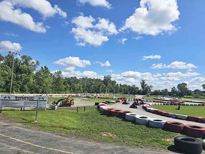 Blue skies, green grass, and a winding track that beckons like a ribbon of pure adventure.