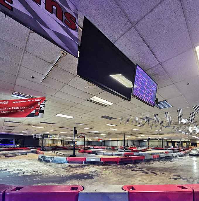 The overhead screens keep everyone honest, tracking lap times like a determined accountant during tax season.