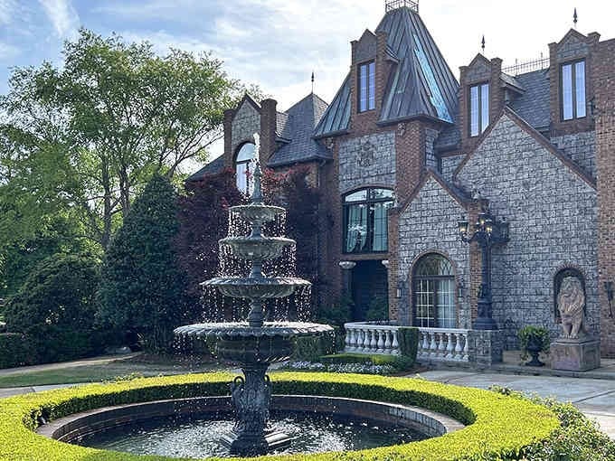 That tiered fountain and manicured hedges create a courtyard worthy of European royalty right here at home.