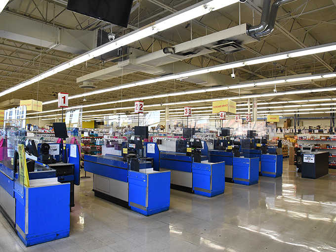 Those bright blue checkout counters line up like a welcoming committee ready to save you serious money.