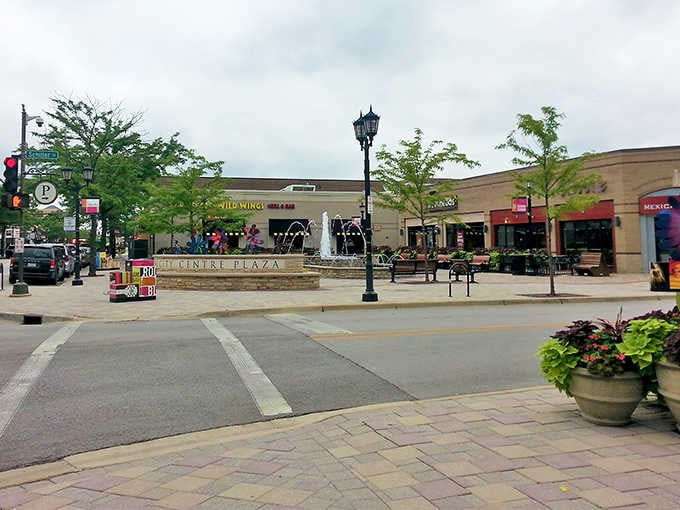 Modern shopping meets thoughtful design at this welcoming plaza, where brick pavers and planters create inviting spaces for community gathering.