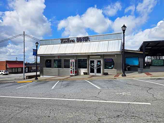 Under dramatic clouds, Fenders Diner stands ready to transport you back when diners ruled the American roadside.