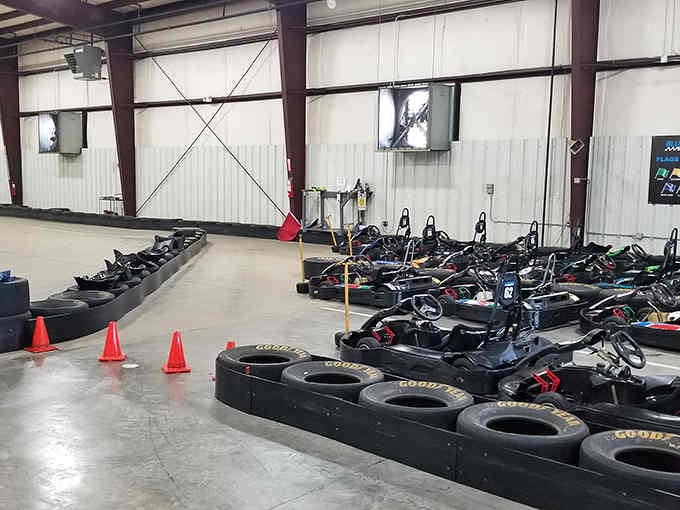 Rows of sleek black karts waiting like racehorses at the starting gate, ready to make your pulse quicken.