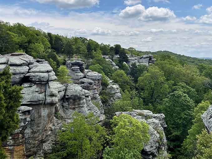 These stacked sandstone towers stand guard over endless green forest like patient sentinels from a forgotten age.