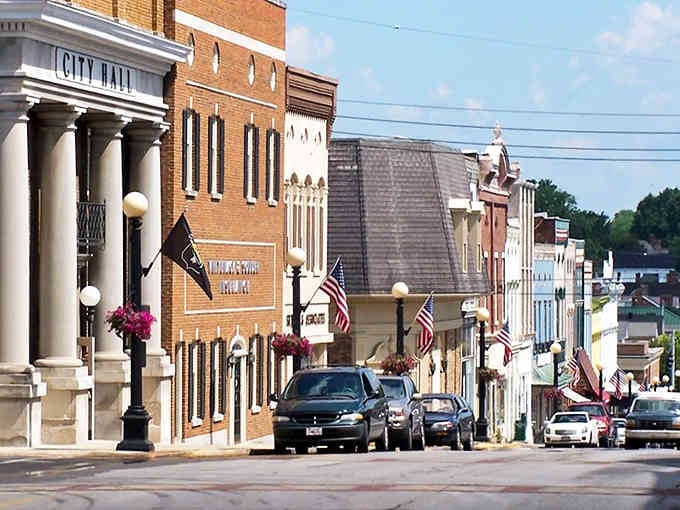 Flags wave proudly above the town square where locals still gather, shop, and catch up on neighborhood news daily.