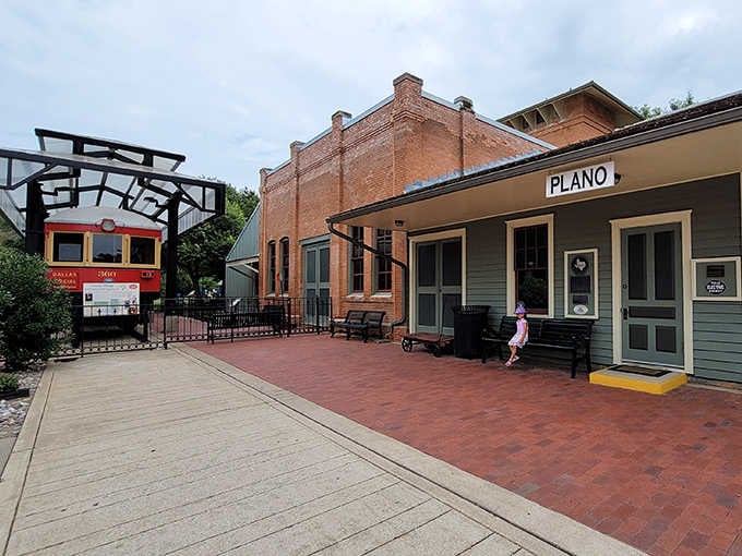 Historic buildings frame a courtyard where passengers once rushed to catch trains that connected North Texas communities.