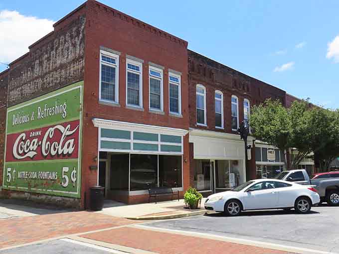 That vintage Coca-Cola sign alone is worth the trip, reminding us when a nickel actually bought something cold.