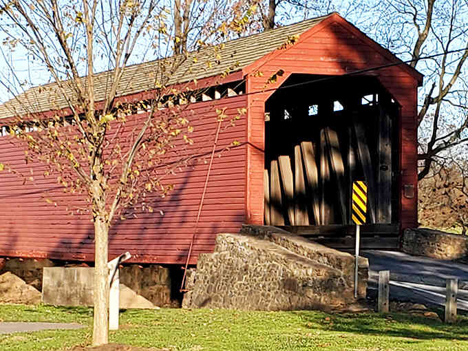 Evening shadows stretch across this classic structure, where stone meets wood in perfect architectural harmony from another era.