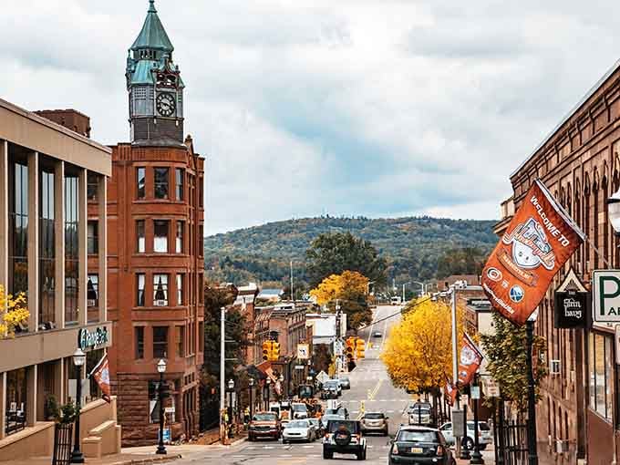That iconic clock tower stands guard over streets that roll toward distant hills painted in autumn's finest colors.