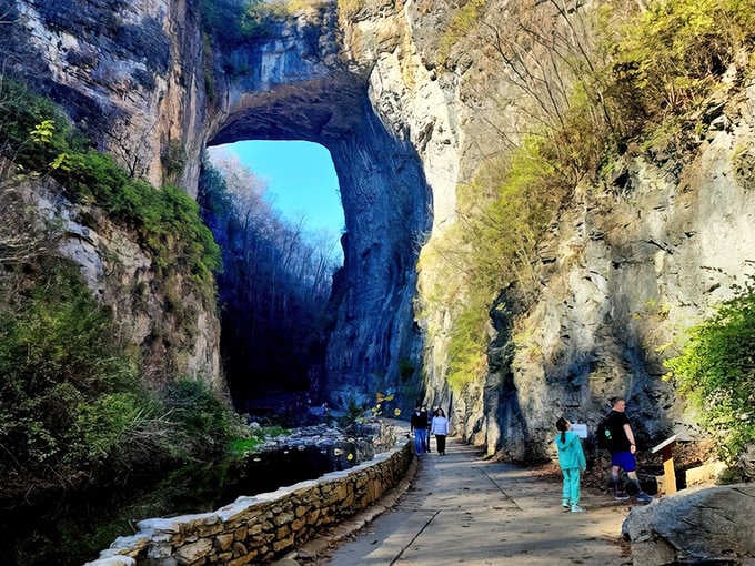 Standing beneath this massive natural arch feels like witnessing geology's greatest achievement, towering overhead with timeless grace and power.