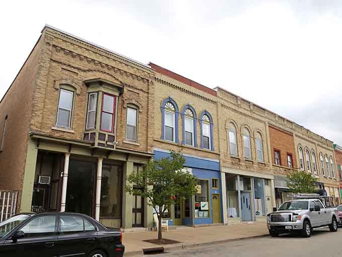 Each colorful storefront adds its own personality to this charming downtown, like characters in a beloved novel.