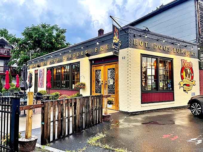 Red umbrellas and outdoor seating create the perfect spot to enjoy creative dogs that balance tradition with delicious adventure.