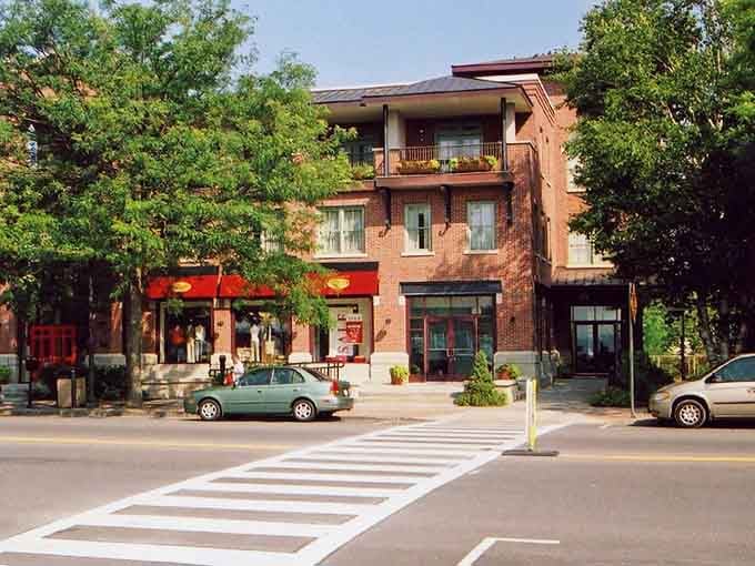 Tree-lined streets and brick buildings blend perfectly where modern life meets timeless small-town character and warmth.