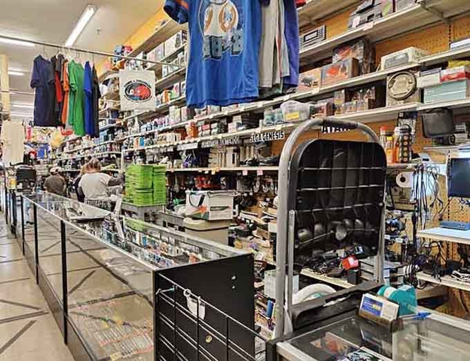 Floor-to-ceiling shelves packed tighter than your grandma's attic reveal decades of collectibles waiting for their second act.