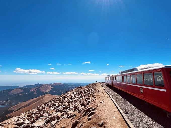 At 14,115 feet, the summit platform offers views so vast you'll swear you can see tomorrow's weather rolling in.