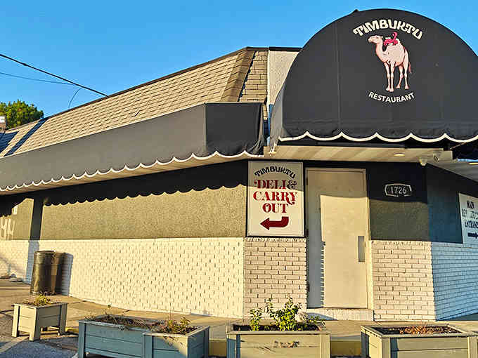 The sunny afternoon glow on this building tells you good times and even better food are just steps away.