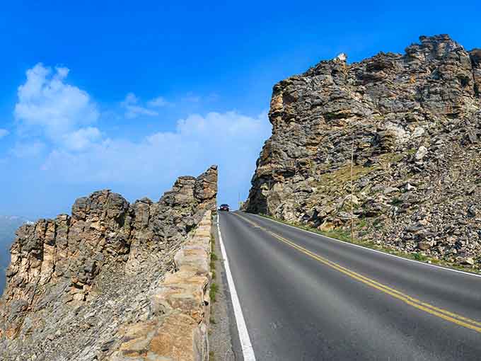 Ancient rocks stand guard along this high-altitude passage like nature's own security detail watching over travelers.