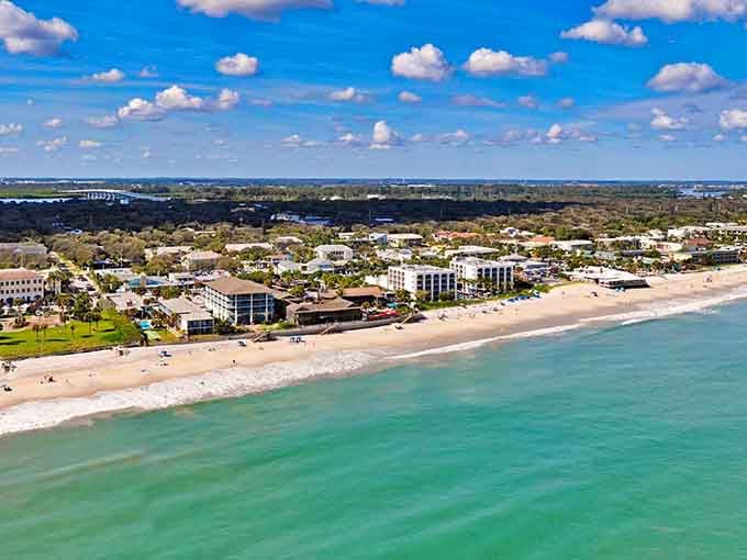 That pristine coastline meets perfectly planned neighborhoods where morning walks end at the beach instead of the mailbox.