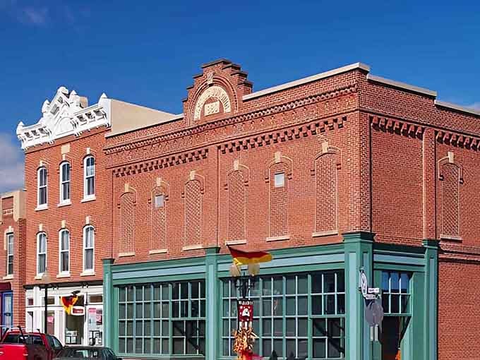 That ornate roofline and rich red brick tell you Warba's downtown once had serious architectural ambitions.