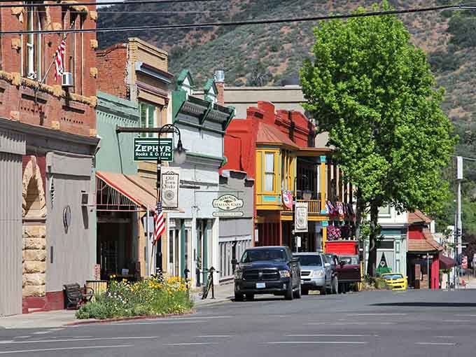 Colorful storefronts pop against mountain backdrops in this town where every building has seen more history than most museums.