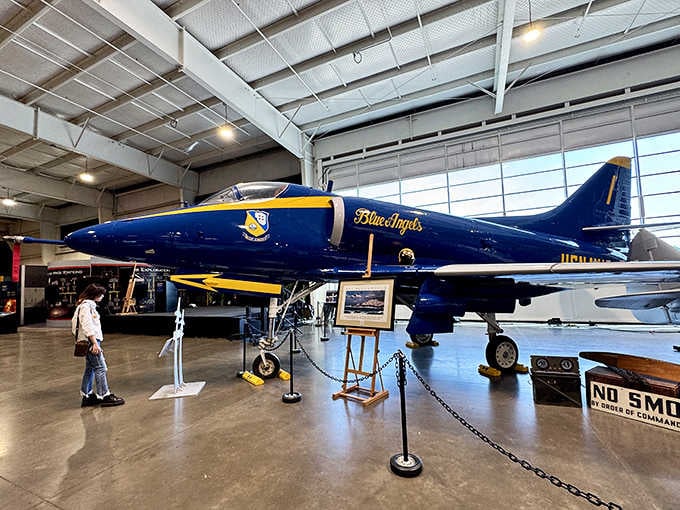 The Blue Angels' A-4 Skyhawk gleams in its iconic navy and gold livery, looking ready to thrill crowds again.