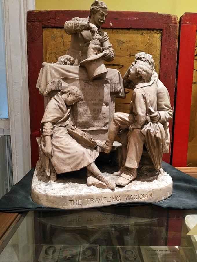 This charming sculpture captures the essence of traveling magicians who once amazed families across America with their craft.