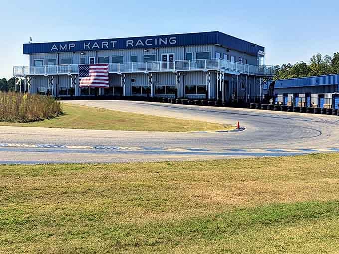 The AMP Kart Racing facility stands proud with Old Glory flying, ready to turn ordinary folks into racing legends.