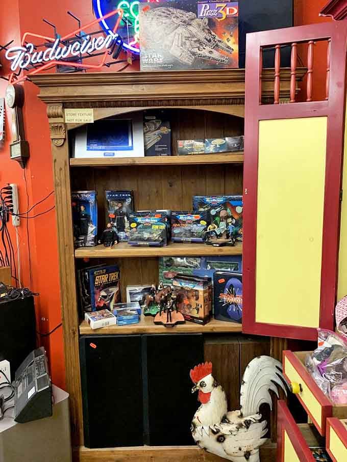 Star Wars collectibles share shelf space with a Budweiser sign because why choose between fandoms?