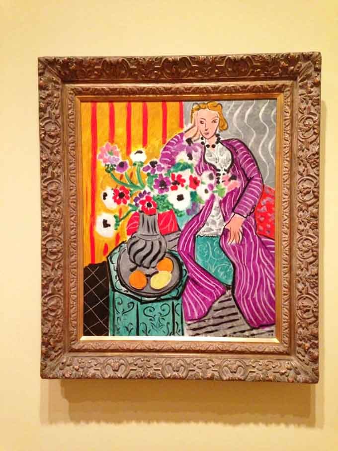 Matisse's "Purple Robe and Anemones" explodes with color like a visual symphony that refuses to whisper.