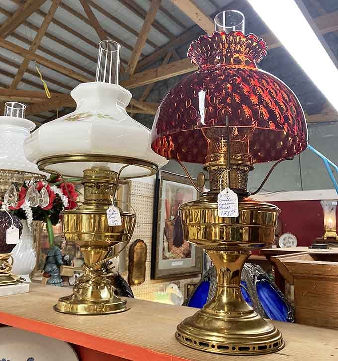 These vintage oil lamps glow with ruby and milk-glass elegance, casting the kind of warm light your great-grandparents courted by.