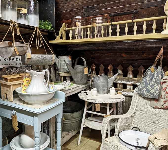 Farmhouse charm meets practical beauty in displays of weathered wood, galvanized metal, and timeless pottery.