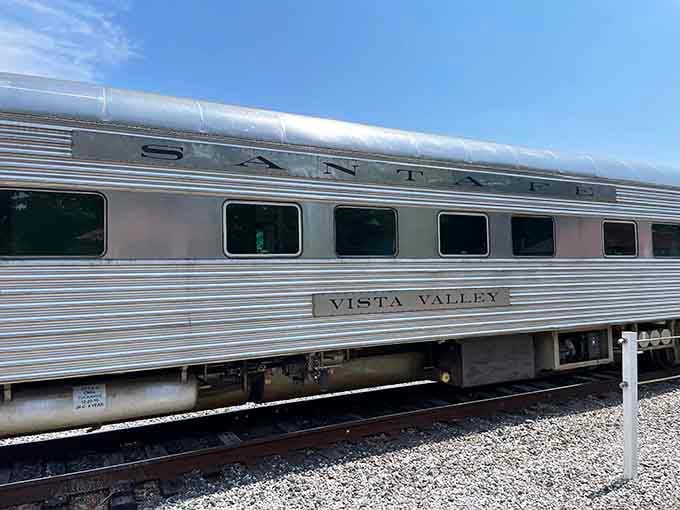 The sleek Santa Fe Railway passenger car gleams like a silver bullet from transportation's most elegant era.