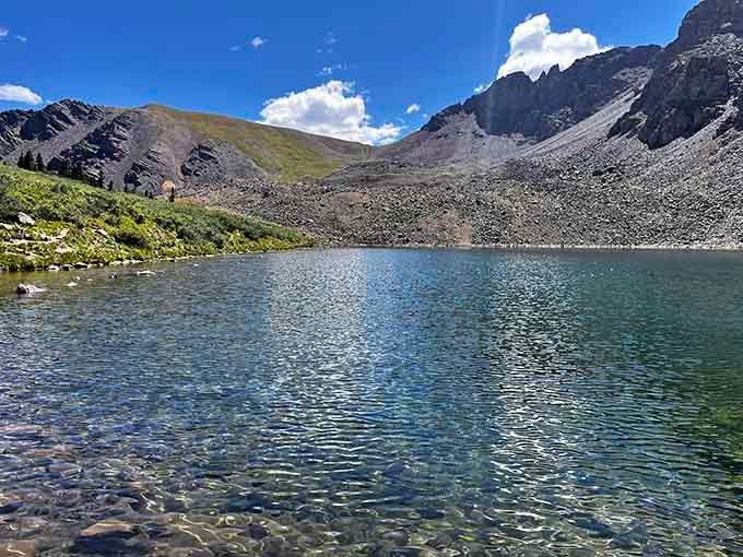 Cathedral Lake reflects the surrounding peaks like a mirror that forgot it was supposed to show your reflection instead.