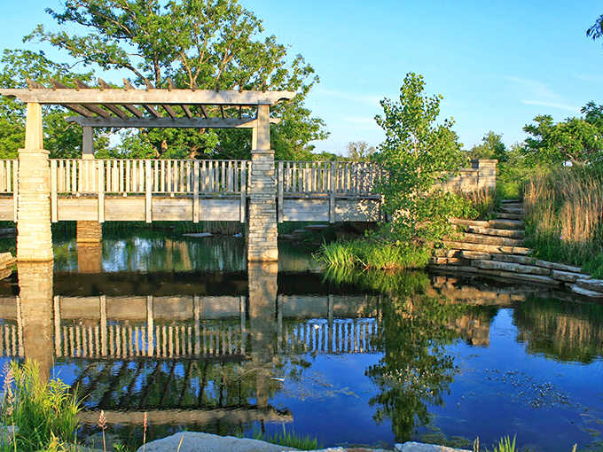Coffee Creek Preserve's boardwalk reflects perfectly in still waters, creating nature's own meditation space right in town.