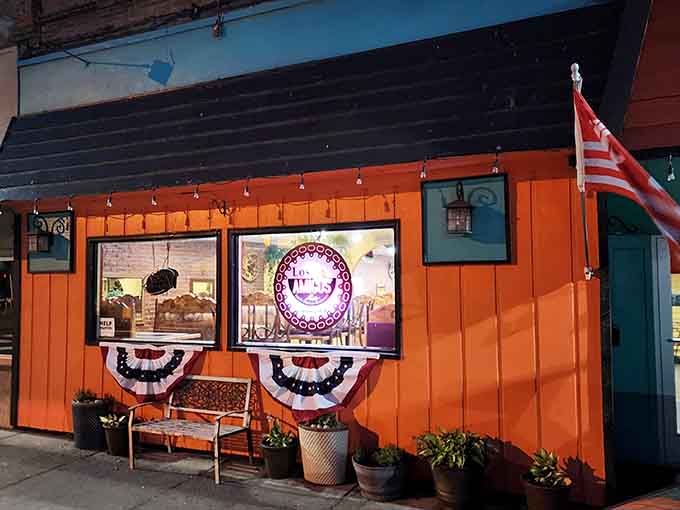 That orange facade practically glows with the promise of good food and even better company inside.