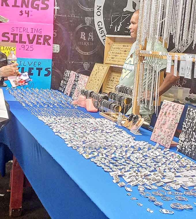 Sterling silver sprawls across blue velvet like a pirate's treasure, minus the cursed doubloons and angry parrots.