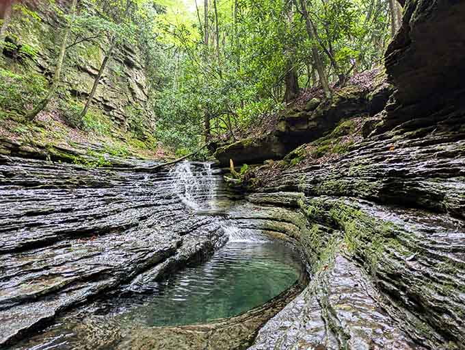 Water cascades over ancient rock formations, creating a multi-tiered masterpiece that puts most fountains to shame completely.