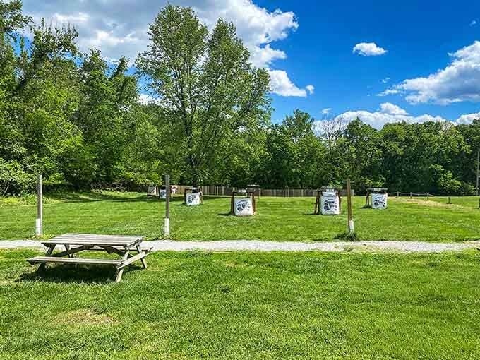 Multiple archery targets standing ready like patient teachers waiting for you to finally hit something besides air.