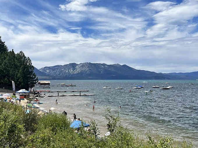 Swimmers dot the shoreline while boats float lazily, creating a scene Norman Rockwell would've painted.