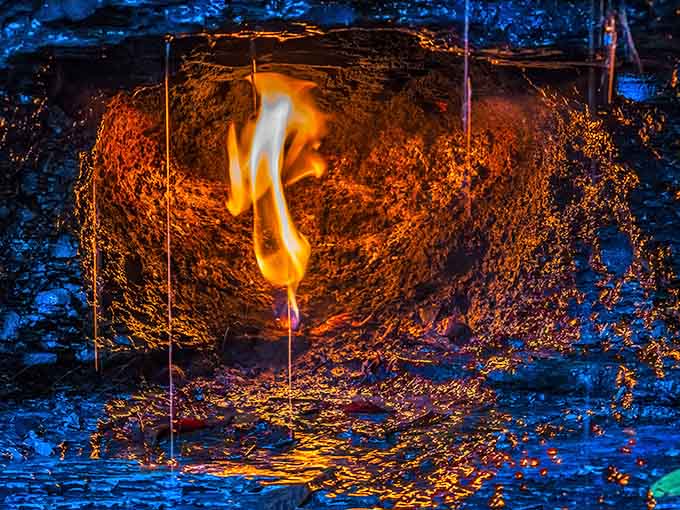 Up close, the golden flame flickers like a campfire that forgot it's supposed to be impossible to exist.