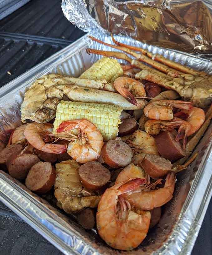 Behold the aluminum tray of happiness: shrimp, crab, corn, potatoes, and sausage steamed to absolute perfection together.
