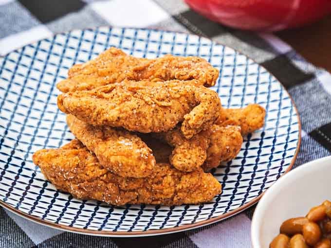 Golden, crispy, and glistening with promise – this is what fried chicken looks like when it's done absolutely right.