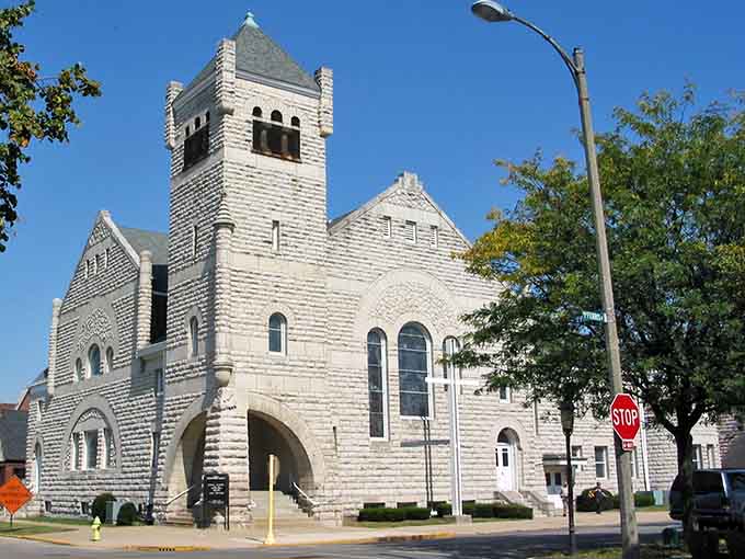 This limestone beauty showcases Romanesque Revival architecture that would make any cathedral jealous of its commanding presence.