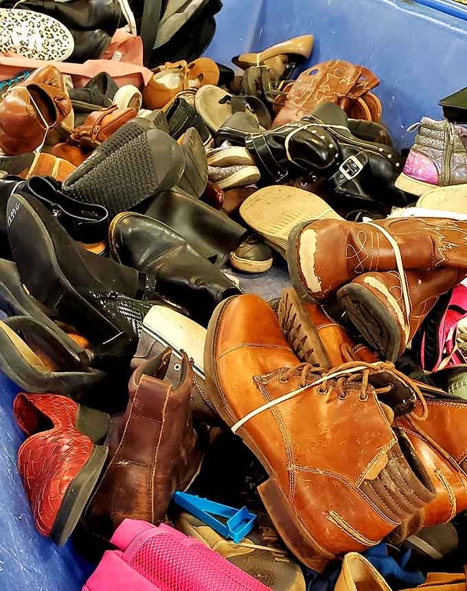 This glorious jumble of leather boots and sneakers proves one person's closet cleanout is another's footwear jackpot waiting.