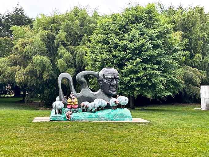 When sculptures get whimsical, you get giant heads with tiny companions having the world's most surreal tea party.